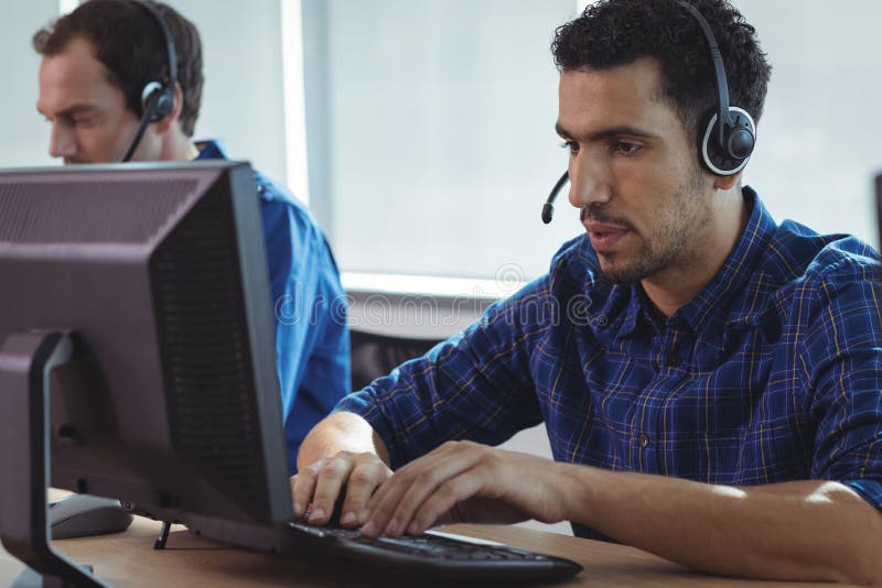 Focused Businessman Working on Computer at Call Center Stock Image ...
