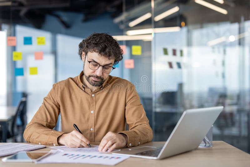 Focused Businessman Working with Documents and Laptop in Office Stock ...