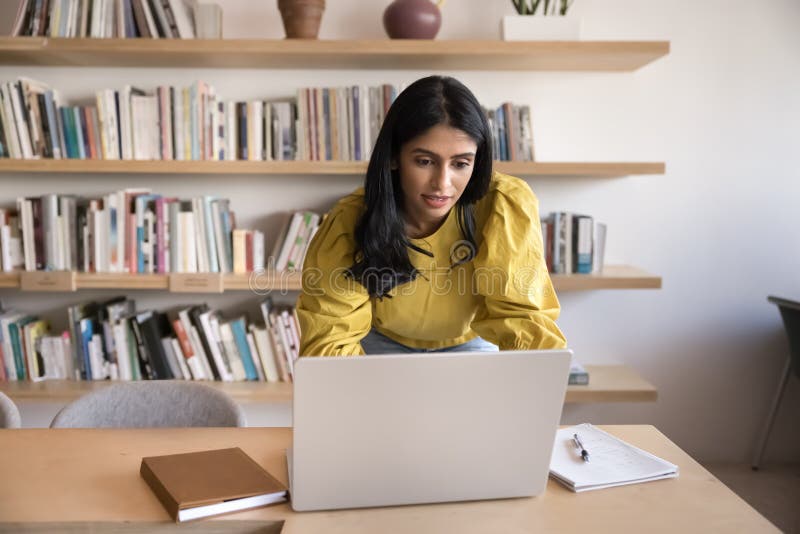 Focused Busy Young Indian Professional Woman Standing at Workplace ...