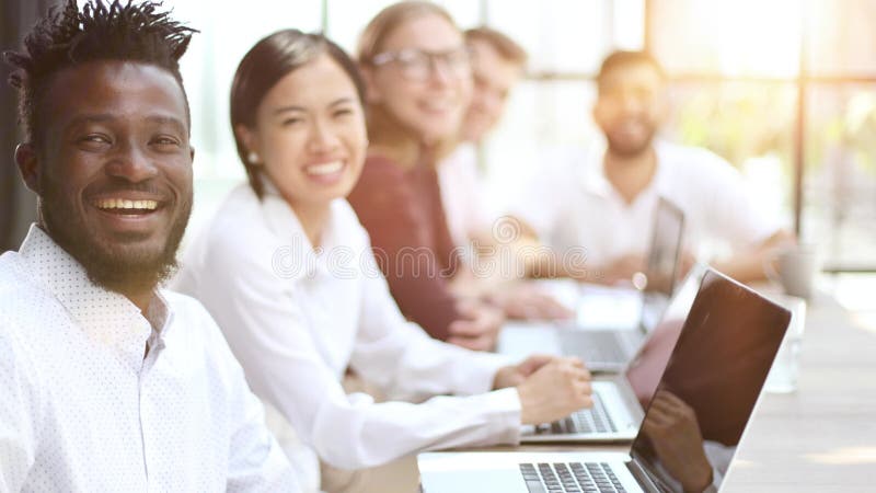 Focused Call Centre Operators with Headphones Working with Computers at ...
