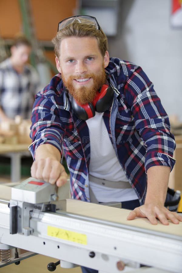 Focused Carpenter at Work with Wooden Plank Stock Image - Image of ...