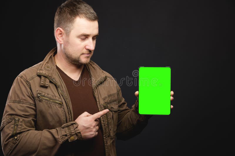 Focused Caucasian Man in Brown Leather Jacket Holding Tablet Using ...