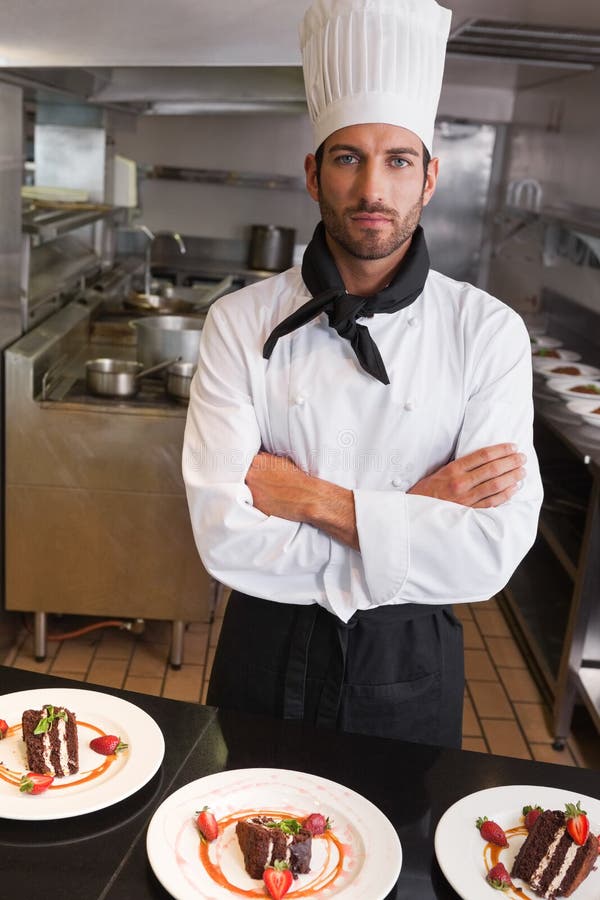Focused Chef Looking at Camera Behind Counter of Desserts Stock Image ...
