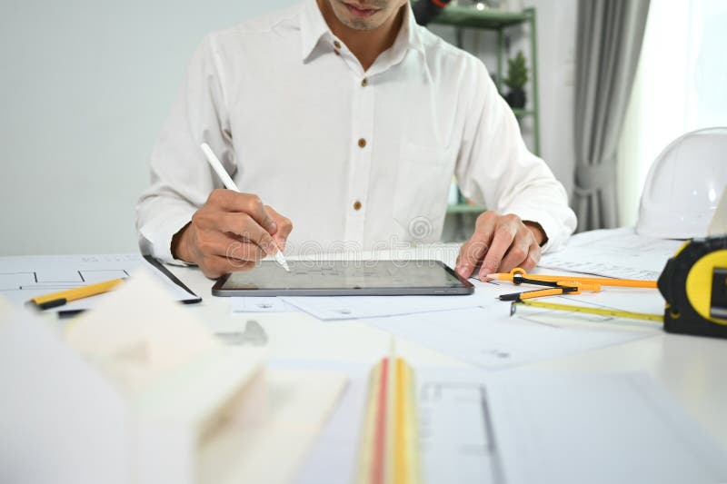 Focused Civil Engineer Man Using Digital Tablet, Inspecting ...