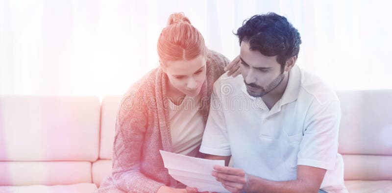 Focused Couple Reading a Book Together on the Sofa Stock Image - Image ...