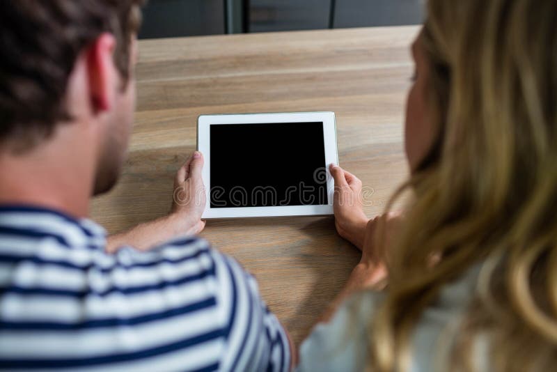 Focused Couple Using Tablet Stock Photo - Image of relationship ...