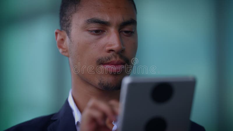 A Focused and Dedicated Professional Utilizing a Tablet in a Modern ...