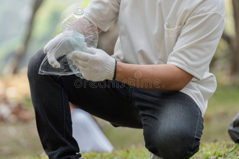 Focused Efforts. Volunteer Sorting Waste during a Cleanup. Stock Image ...