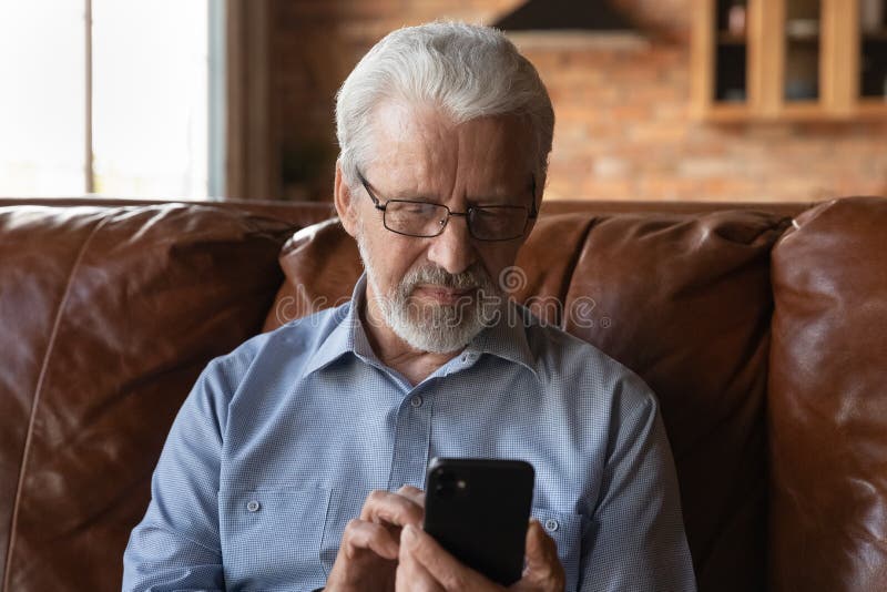 Focused Elder 70s Man Using Telemedicine App on Smartphone Stock Photo ...