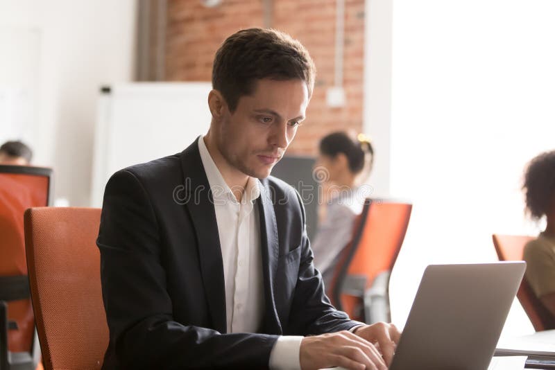 Focused Employee Intern Using Laptop, Working on Online Project Stock ...