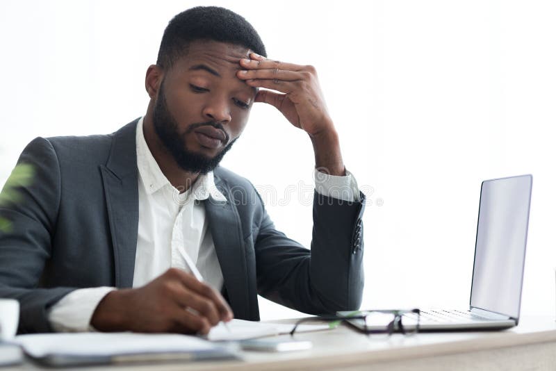 Focused Employee Taking Notes in Notebook at Workplace in Office Stock ...