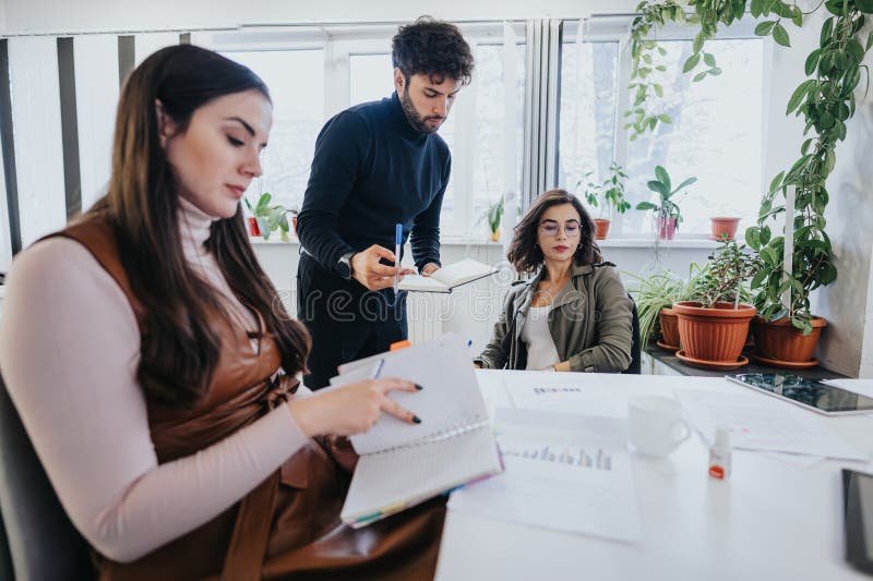 Focused Employees Engaged in Creative Brainstorming in a Bright Office ...
