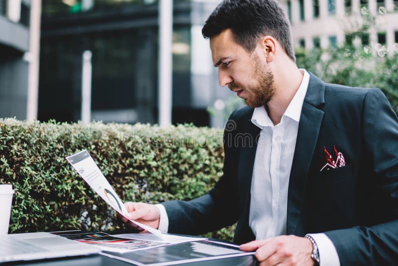 Focused Entrepreneur Looking at Business Documents Stock Image - Image ...