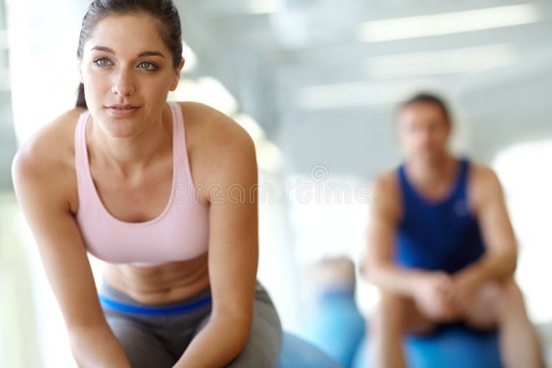 Focused on the Exercise Class. Two People Doing Exercises on Swiss ...