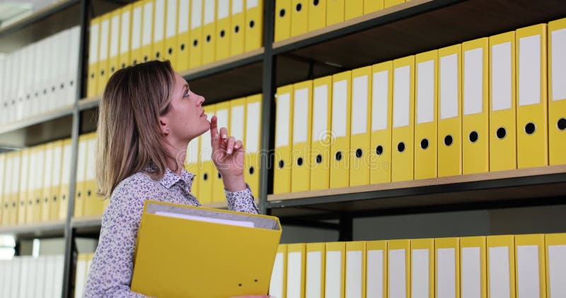 Accountant Looks for Necessary Ring Binder with Documents Stock Footage ...