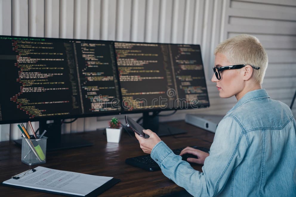 Focused Female Coder Working on Software Development in a Modern Home ...
