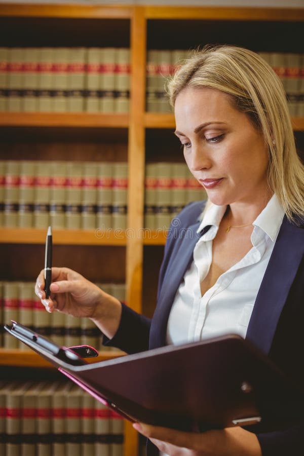 Female Librarian Posing and Holding a Book Stock Photo - Image of ...