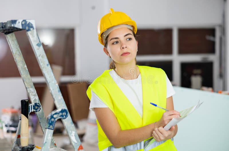 Focused Female Safety Inspector Making Notes at Construction Site Stock ...