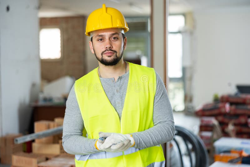 Focused Foreman Posing on Indoor Construction Site Stock Photo - Image ...
