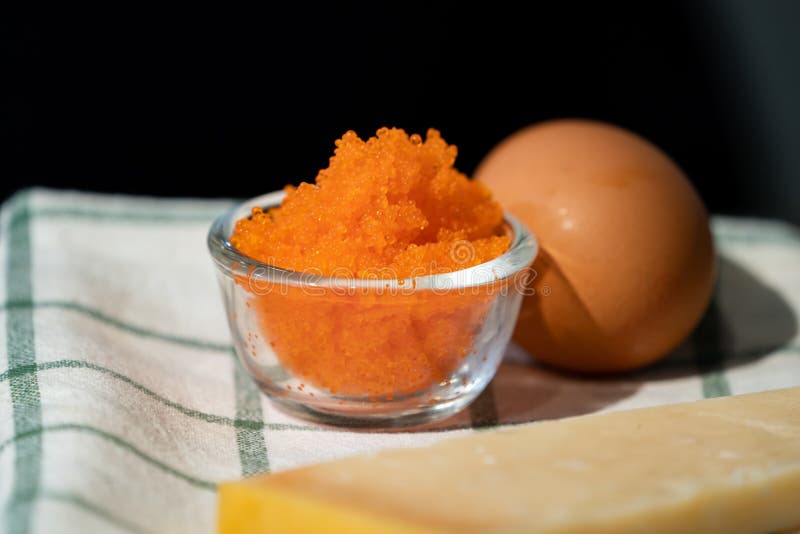 Focused on Fresh Tobiko, Flying Fish Roe with Blur Egg beside it Stock ...