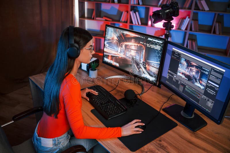 Focused on the Game Process. Young Beautiful Streamer is Indoors with ...