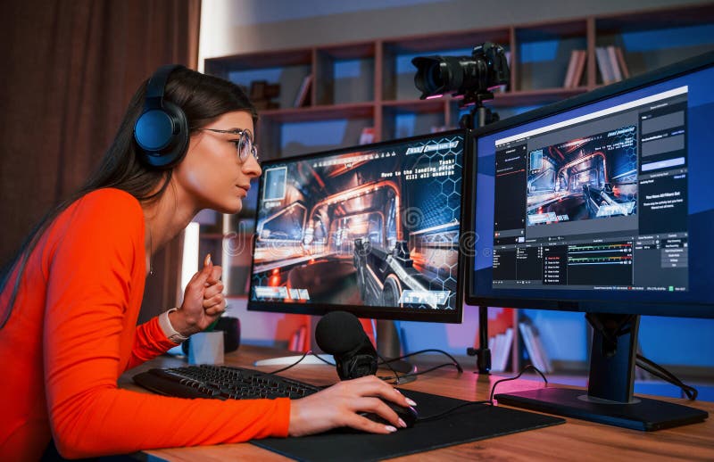 Focused on the Game Process. Young Beautiful Streamer is Indoors with ...