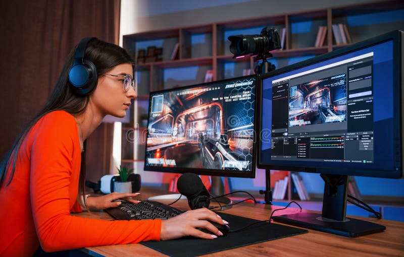 Focused on the Game Process. Young Beautiful Streamer is Indoors with ...