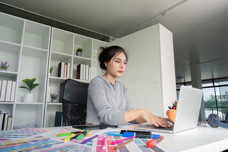Focused Graphic Designer Analyzing Design in a Bright Office Stock ...