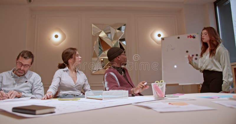 Focused Group of Colleagues Brainstorming and Collaborating on Project ...