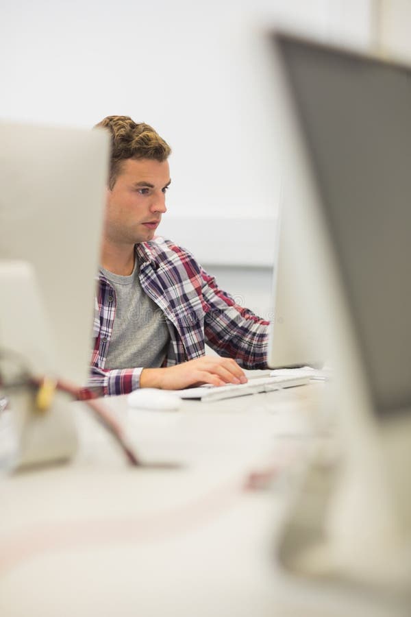 Focused Handsome Student Studying in the Computer Room Stock Image ...