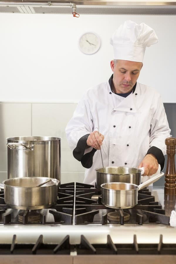 Chef Looking at an Order List in the Commercial Kitchen Stock Photo ...