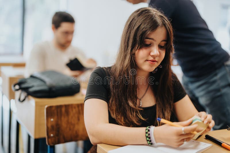 Focused High School Student Takes Notes in Classroom Setting Stock ...
