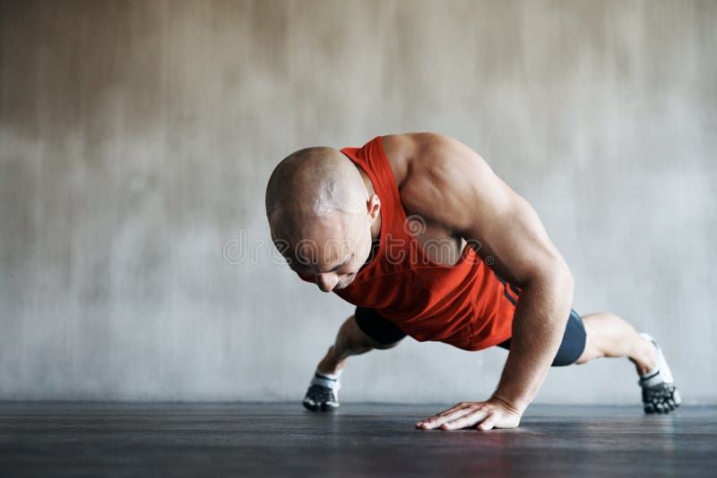 Focused on His Workout Routine. a Man Working Out at the Gym. Stock ...