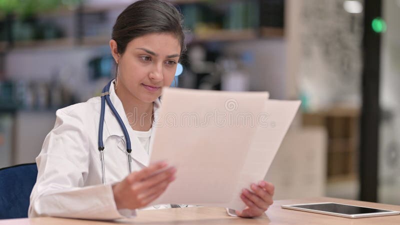 Focused Indian Female Doctor Doing Paperwork Stock Image - Image of ...