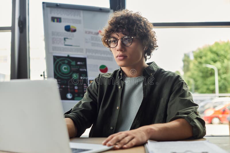 Focused Individual Engages with Technology in Stock Photo - Image of ...