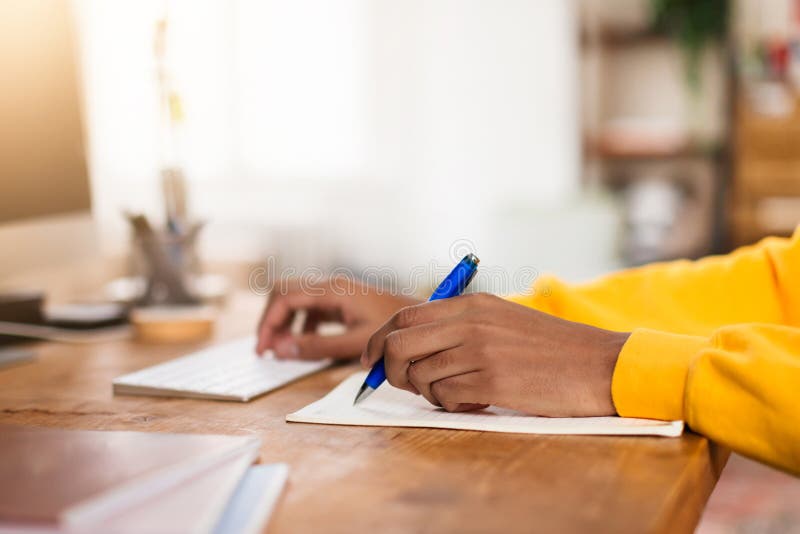 Person Writing Notes beside a Computer Stock Photo - Image of home ...
