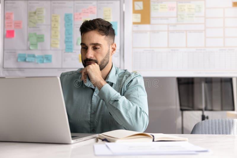 Focused Latin Project Manager Man Working at Computer Stock Photo ...