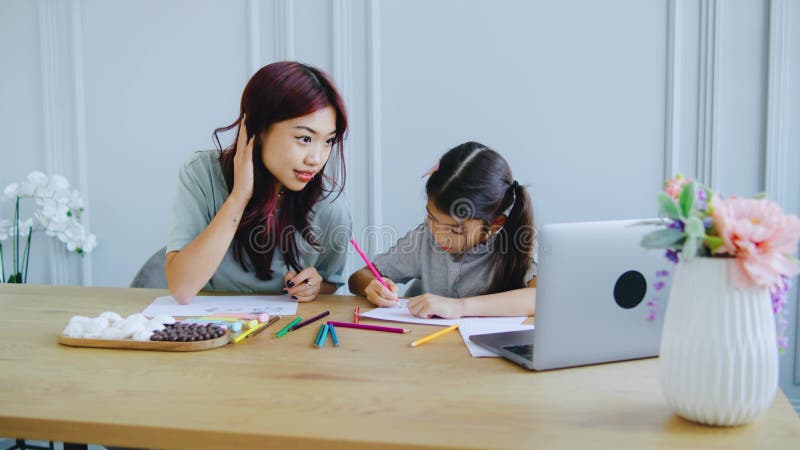 Focused Learning a Girl and a Woman Engage in Creative Activities ... Focused Learning a Girl and a Woman Engage in Creative Activities ...