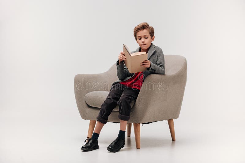 Focused Little Schoolboy Reading Book Stock Image - Image of child ...
