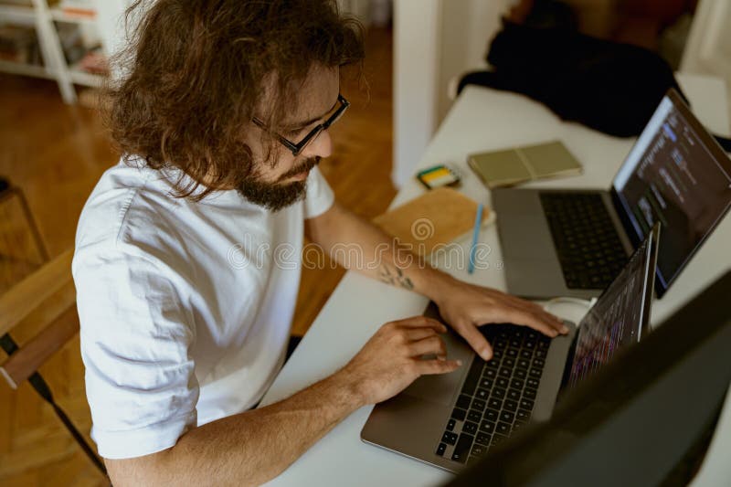 Young Businessman Using Computer while Working Remotely from Home ...
