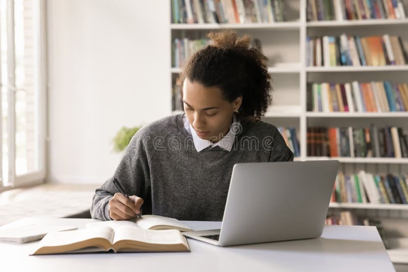 Focused Male Student Work on Project at Library Using Notebook Stock ...