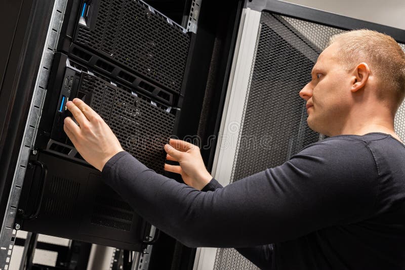 Focused Male Technician Working with Servers in Datacenter Stock Image ...