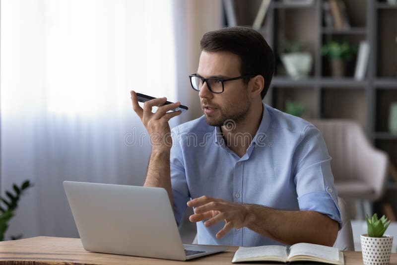 Focused Male Working by Laptop Using Virtual Assistant on Phone Stock ...
