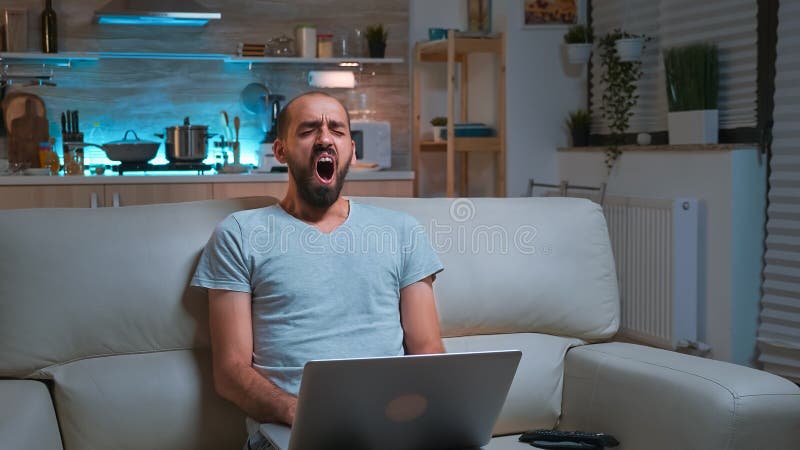 Focused Man Browsing Information on Network Using Laptop Computer Stock ...