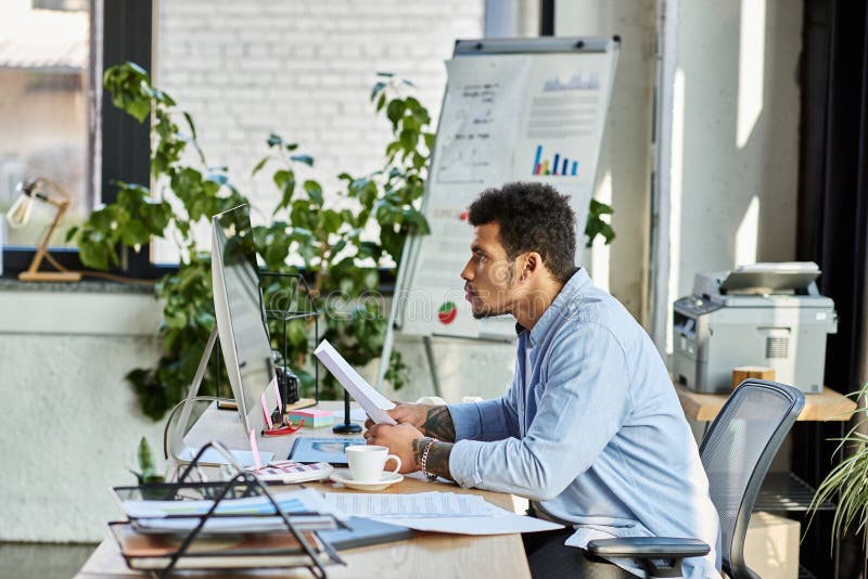 Focused Man Reviewing Documents in a Stock Image - Image of calm, cozy ...