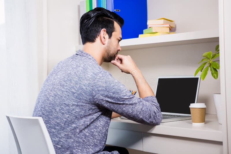 Focused man using laptop stock image. Image of gesturing - 66093033