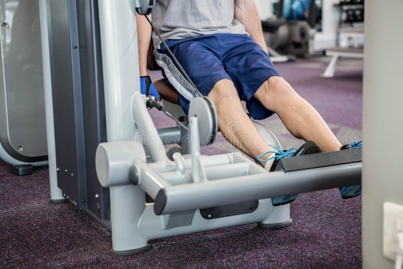 Focused Man Using Weights Machine for Legs Stock Image - Image of ...