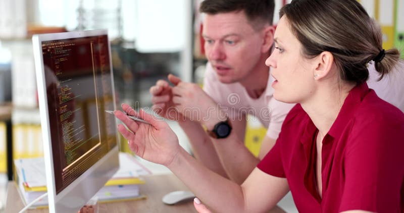Focused Man and Woman Discuss Development of New Project at Work Stock ...