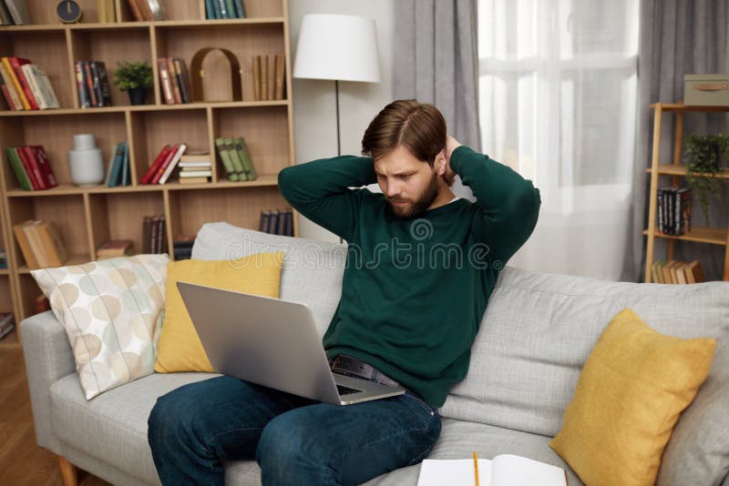 Focused Man Working Laptop. Handsome Young Man Using Laptop Computer ...