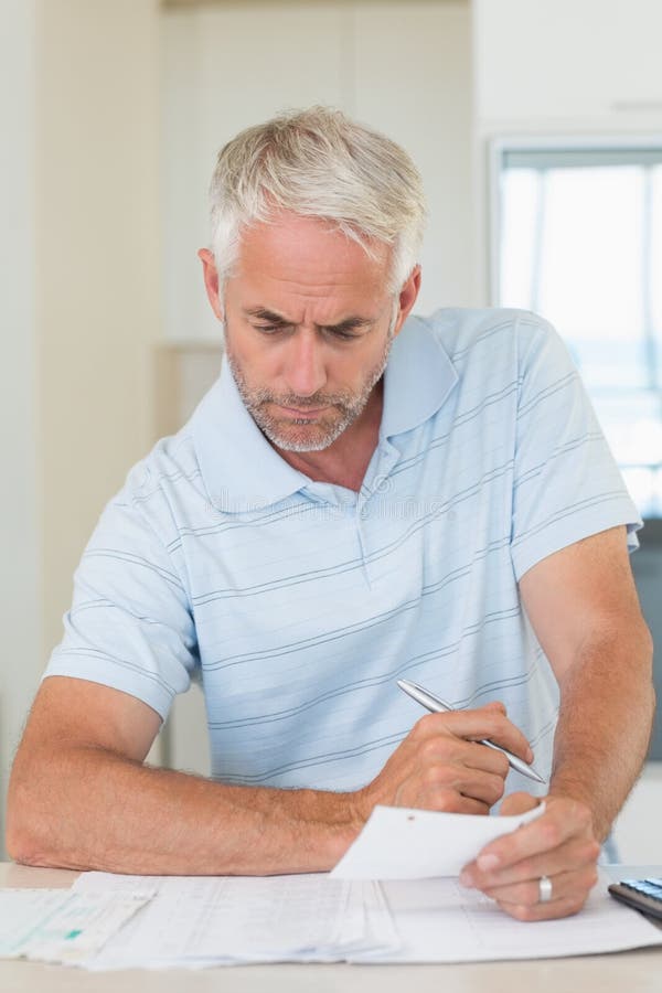 Focused Man Working Out His Finances Stock Image - Image of grey ...